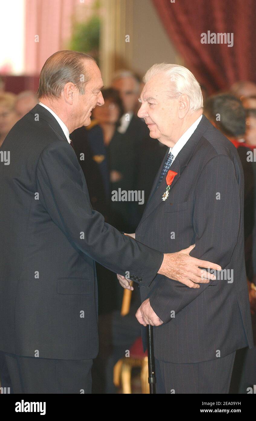 French President Jacques Chirac awards Rene Monory with the order of ...