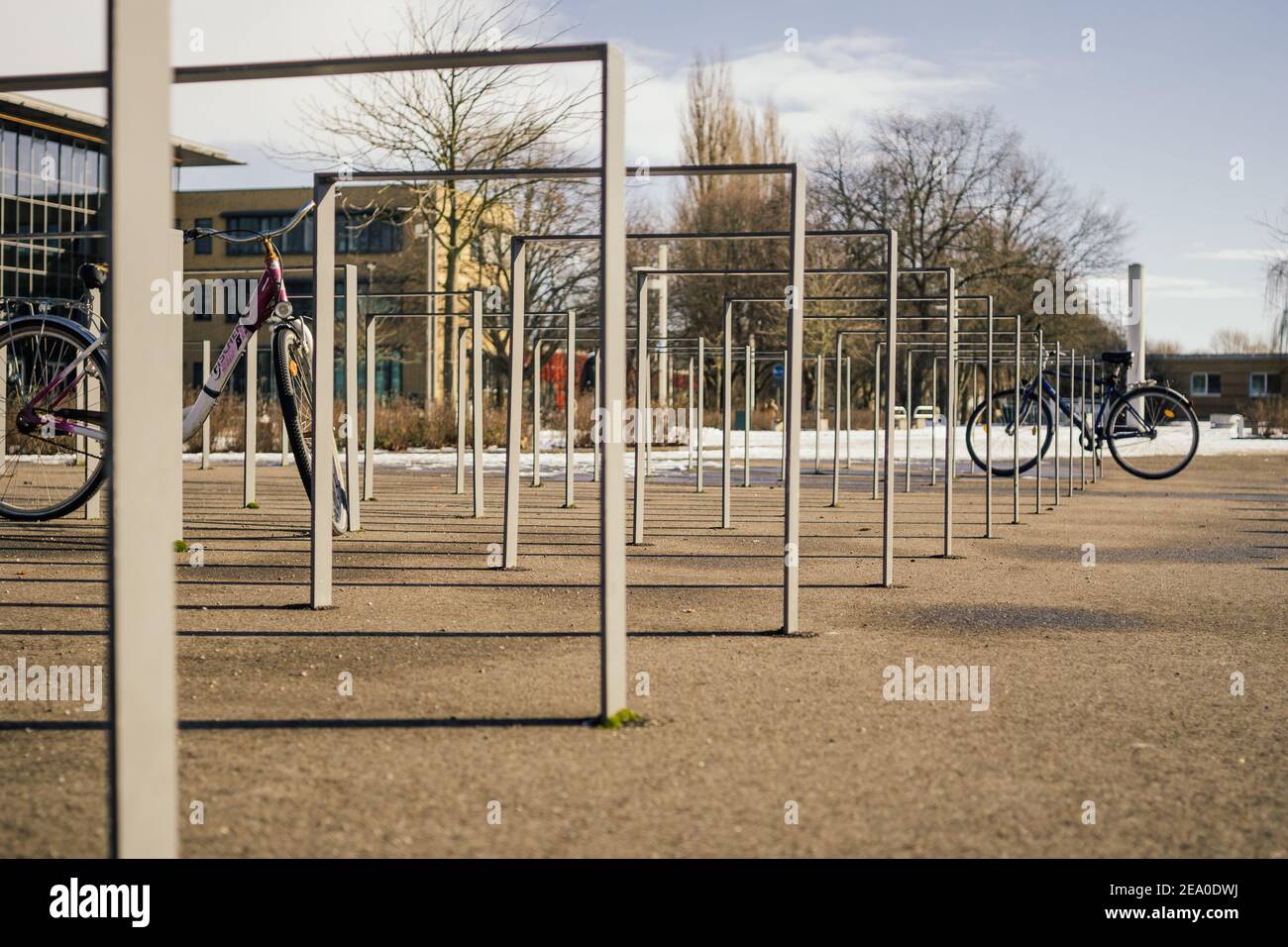 Bicycle rack in a public place with two bicycles Stock Photo - Alamy