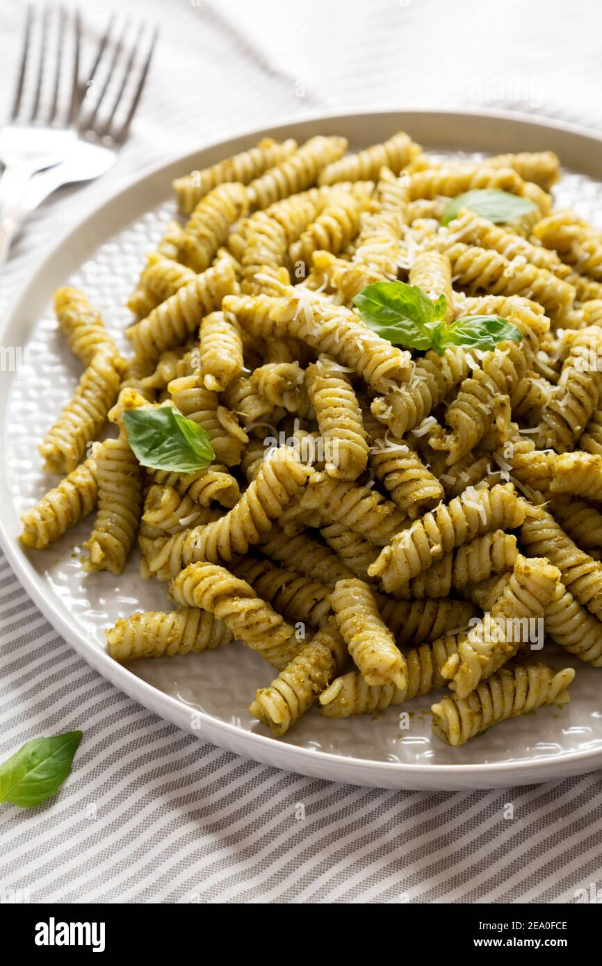 Homemade Pesto Twist Pasta on a plate, side view Stock Photo - Alamy