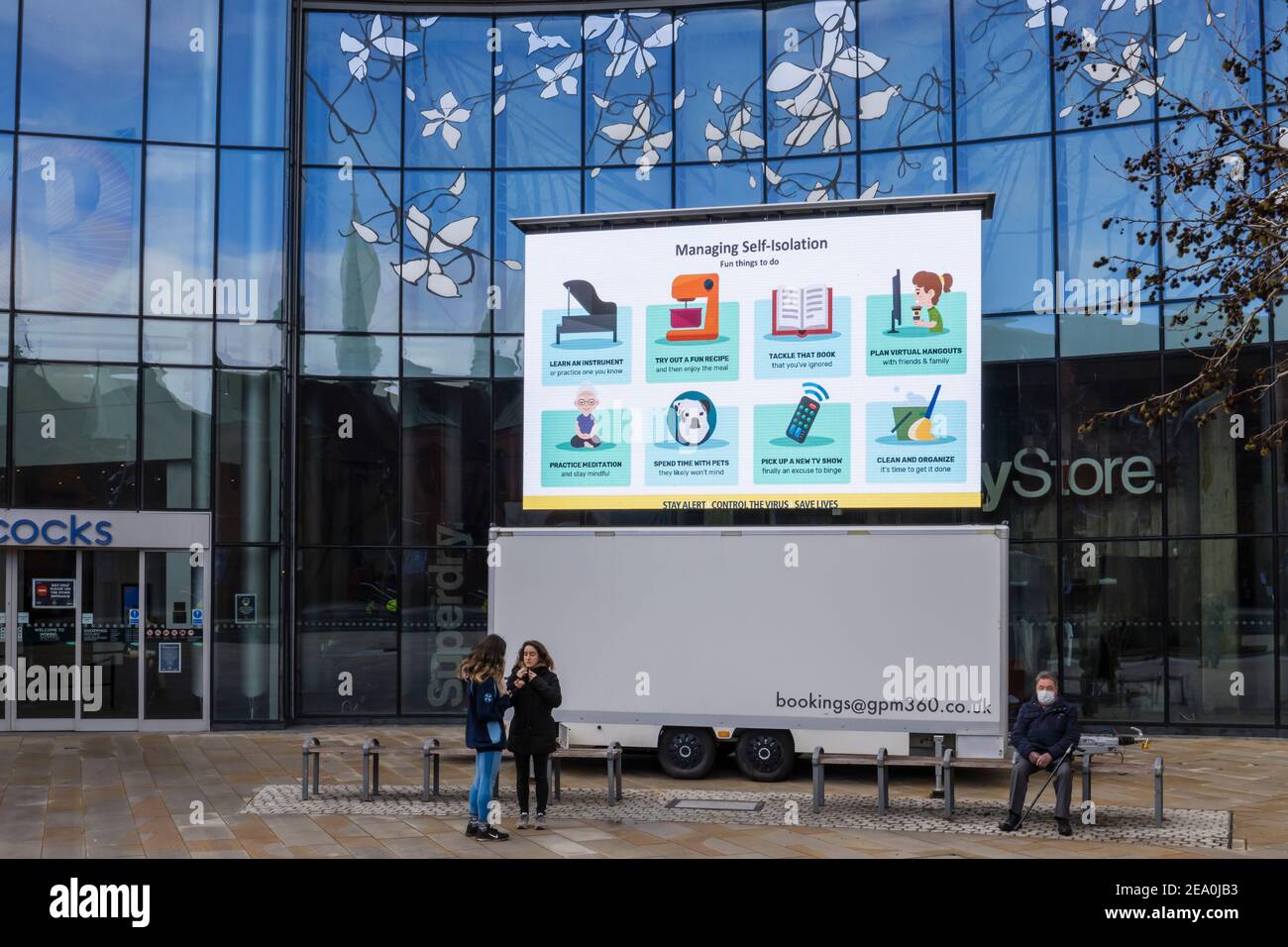 Illuminated panel sign with COVID-19 lockdown messages for managing ...