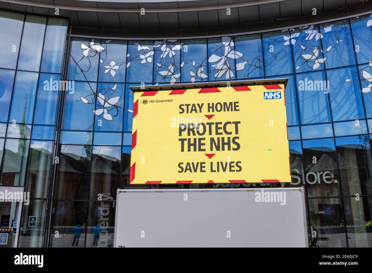 Illuminated panel sign with COVID-19 lockdown 'Protect the NHS, Save ...