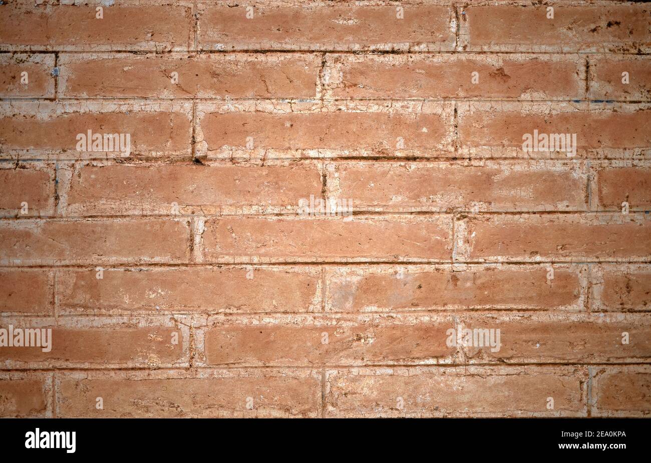 detail of a part of a wall made of old brownish-red solid bricks joined ...