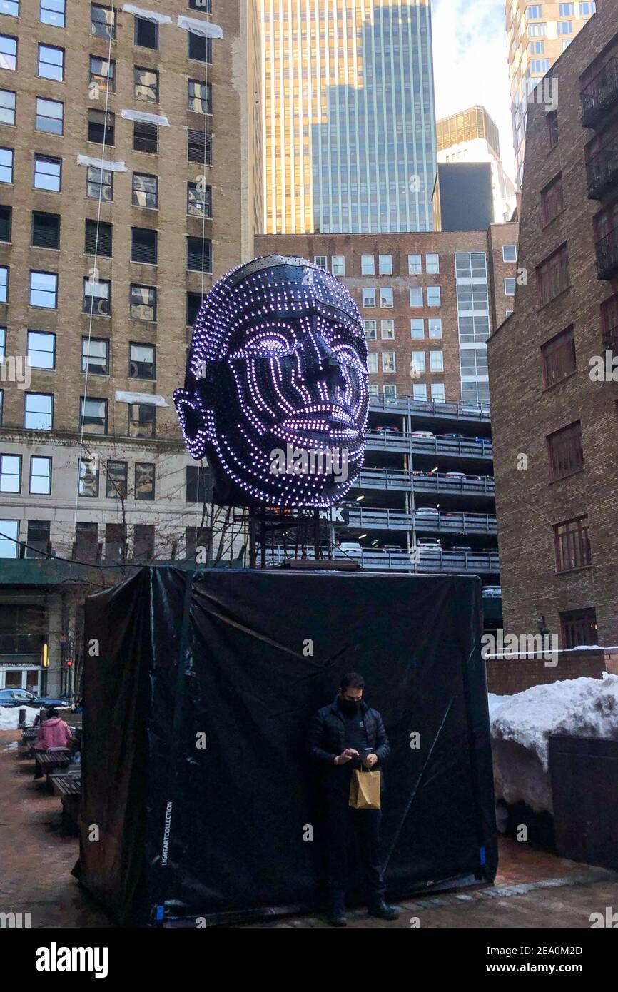 Talking Heads, a light installation by artist Viktor Vicsek, is installed outside of 85 Broad ...