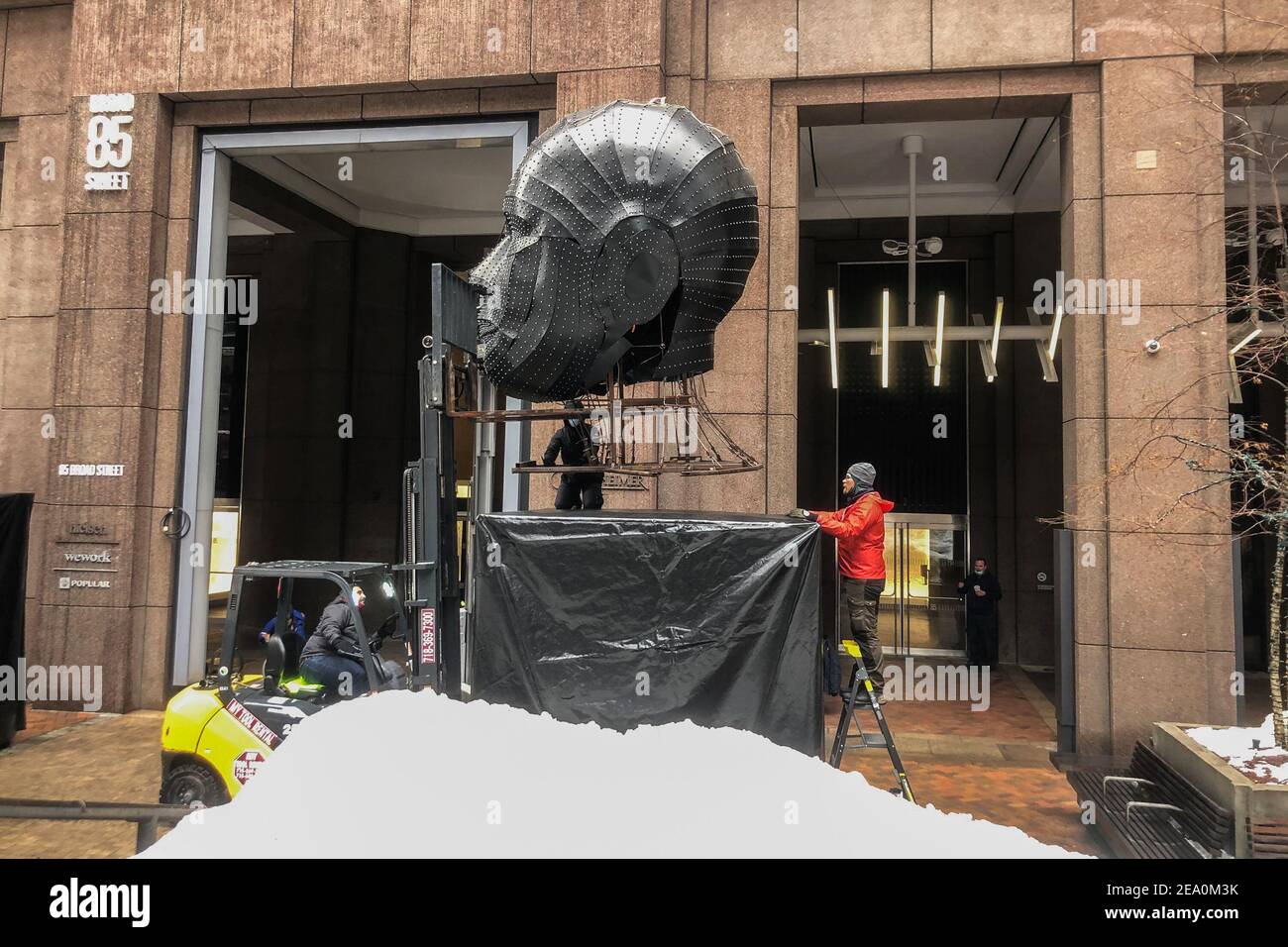 Talking Heads, a light installation by artist Viktor Vicsek, is installed outside of 85 Broad ...