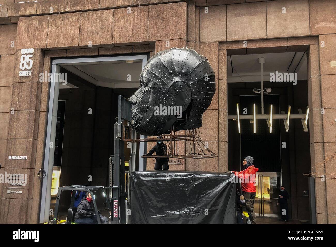 Talking Heads, a light installation by artist Viktor Vicsek, is installed outside of 85 Broad ...