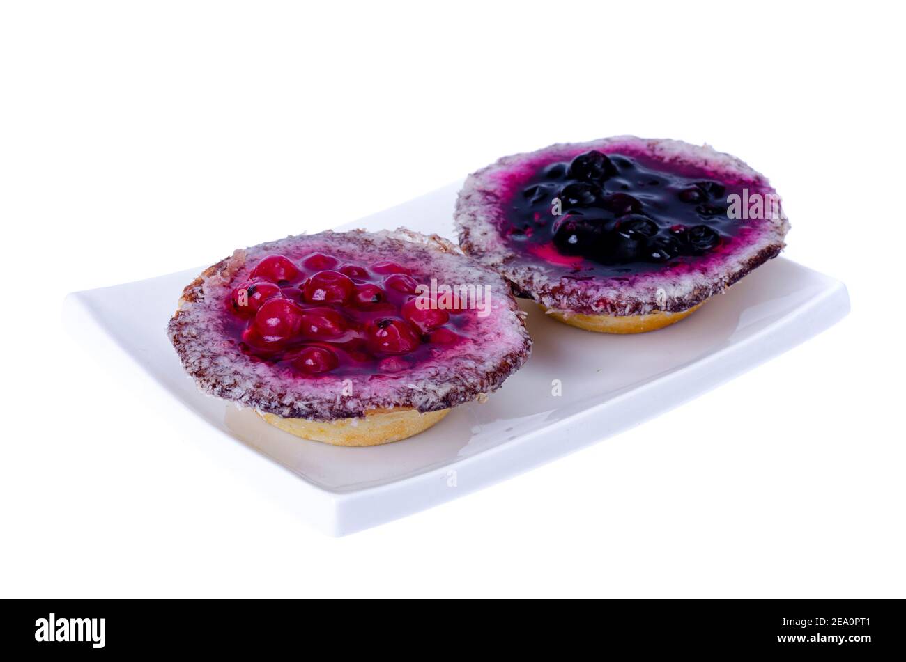 Sand baskets with sweet berries and jelly on white background. Photo ...