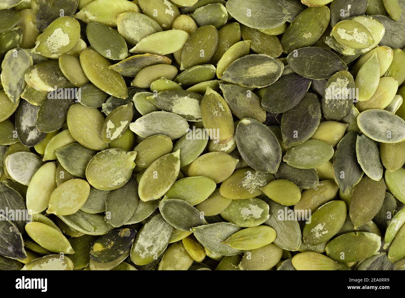 Pumpkin seeds background. Green pepita seeds. Top view Stock Photo - Alamy