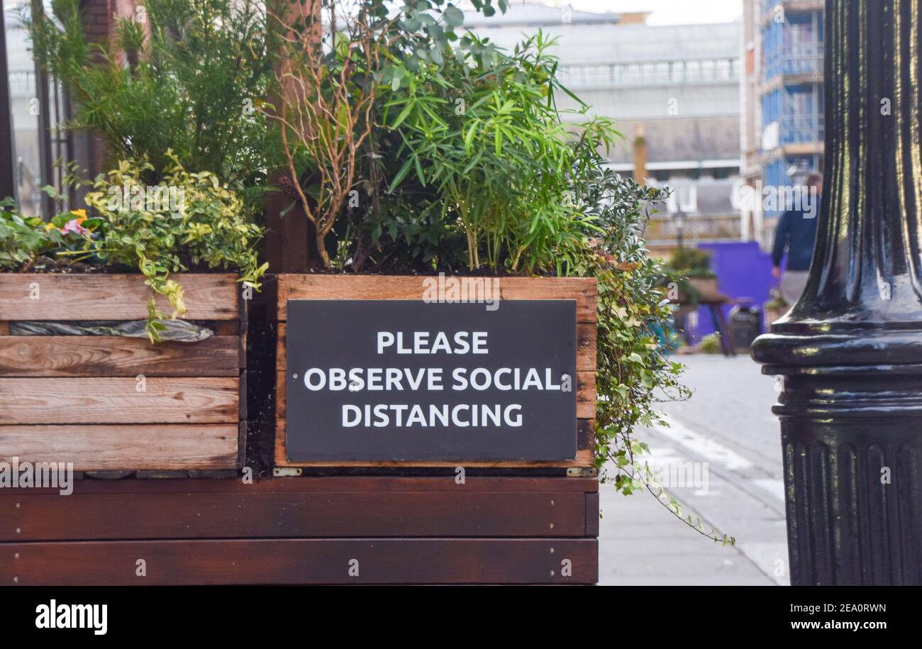 London, UK. 2nd Feb, 2021. 'Please Observe Social Distancing' sign in ...