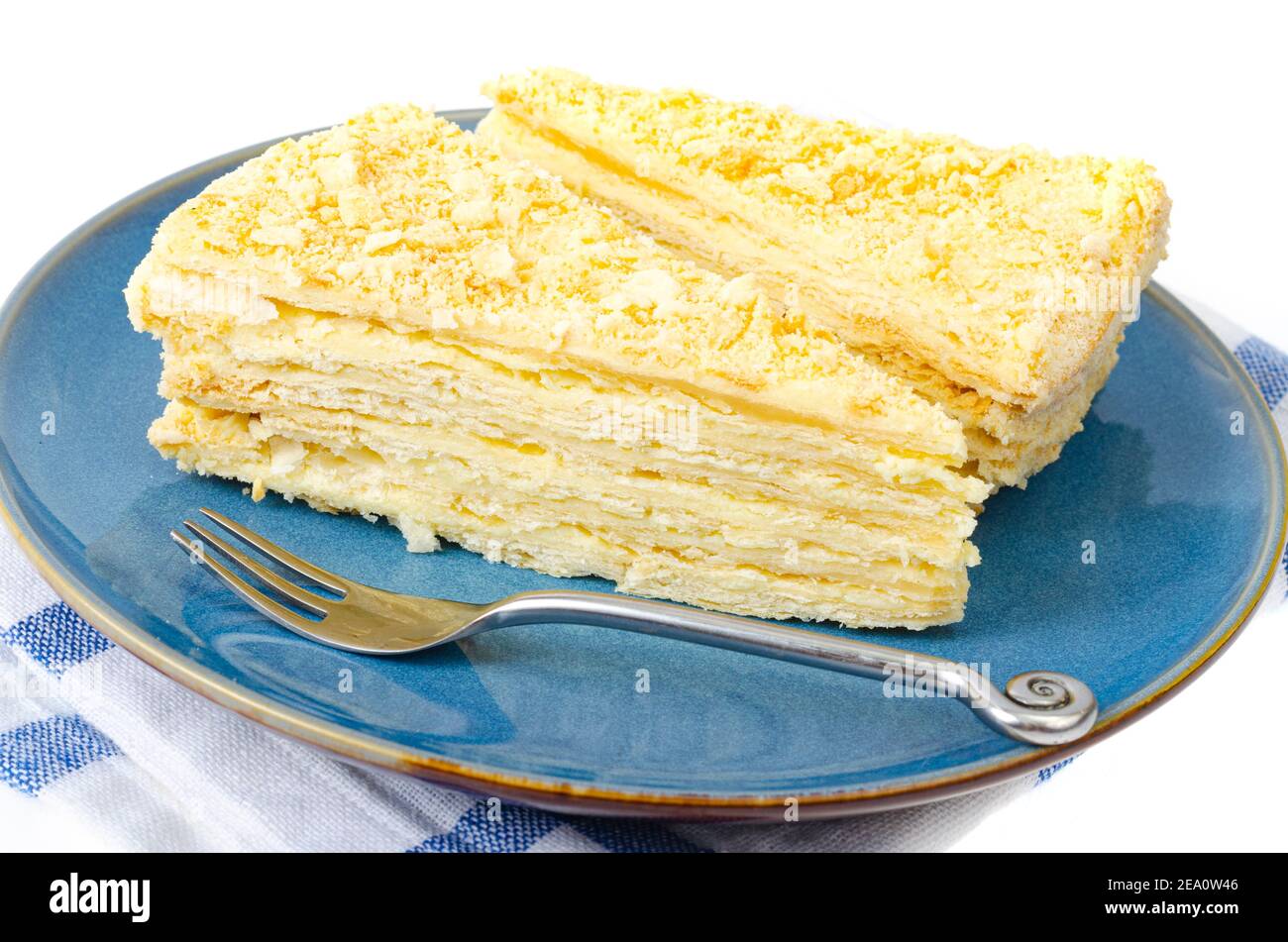 Plate with slice of homemade puff pastry with cream. Photo Stock Photo ...