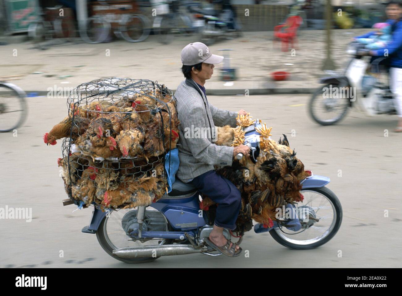 Asia,Vietnam, Hue, Street Scene, Man Riding Motorbike Transporting ...