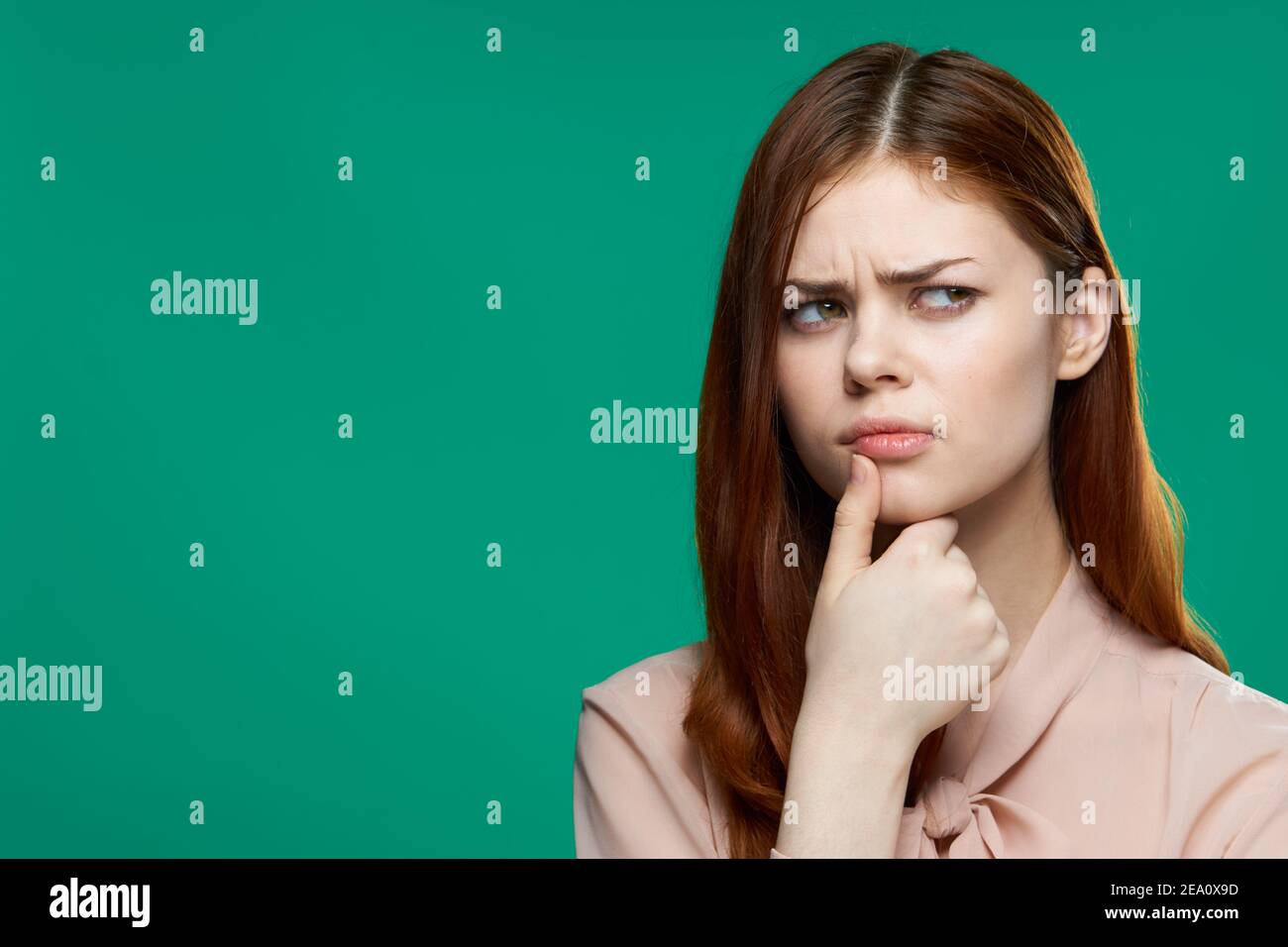 beautiful woman emotions hand near face cosmetics studio green ...