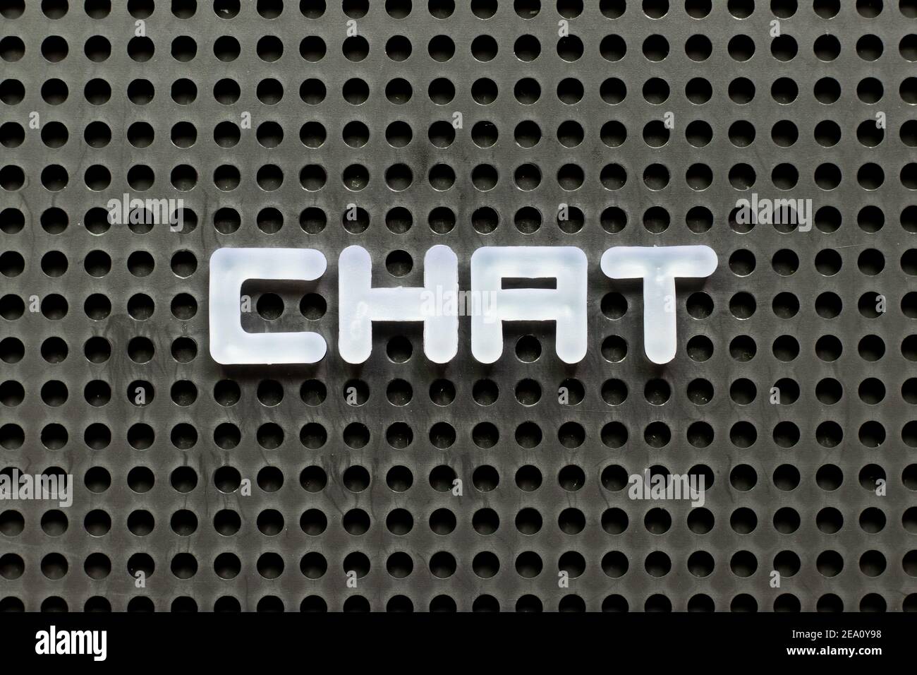 White color letter in word chat on black pegboard background Stock ...