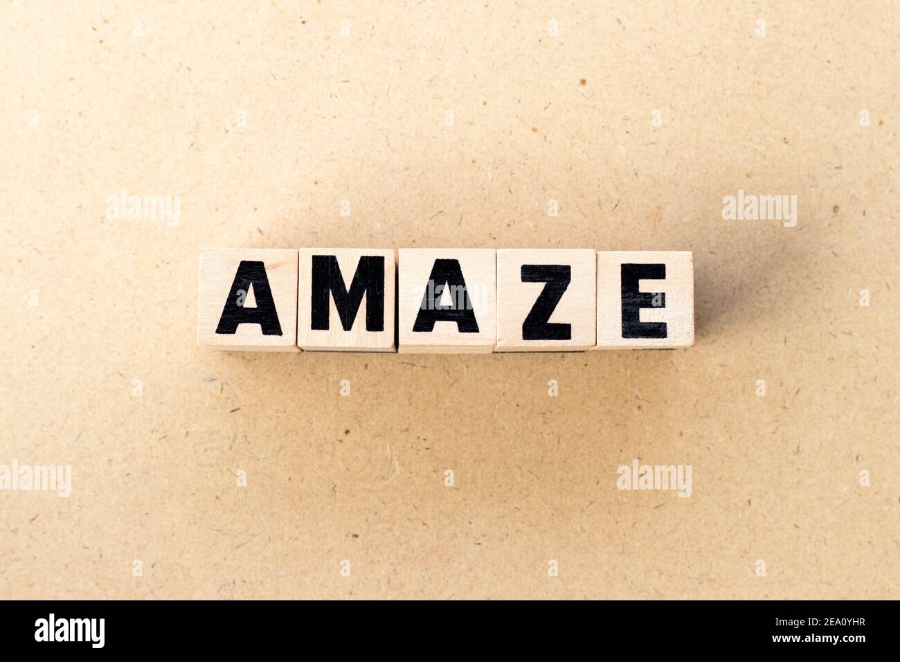 Letter block in word amaze on wood background Stock Photo - Alamy