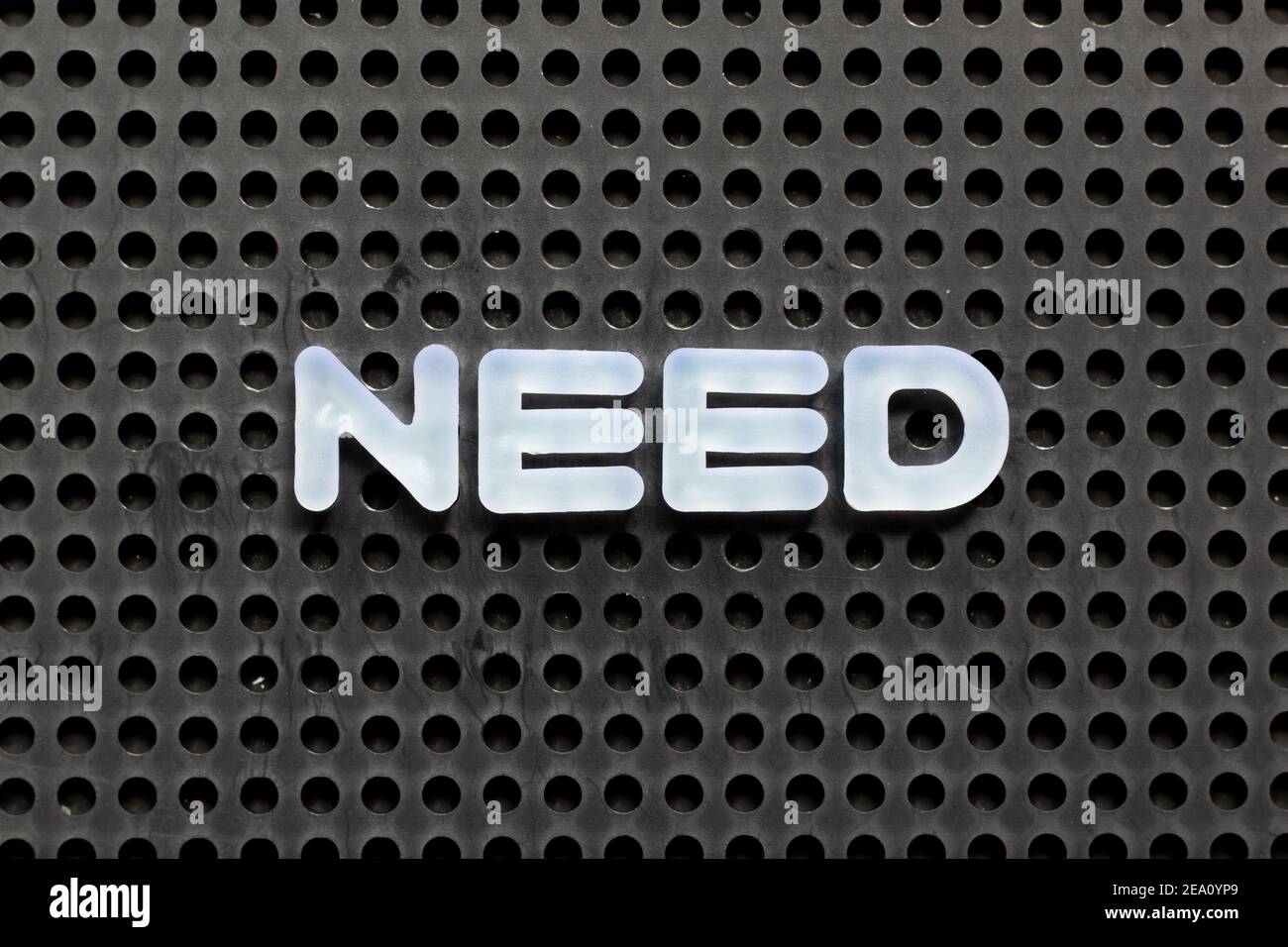 White color letter in word need on black pegboard background Stock ...
