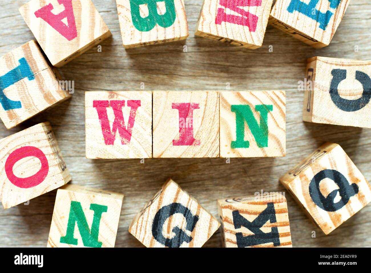 Alphabet letter block in word win with another on wood background Stock ...