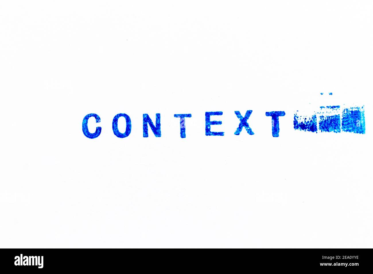 Blue color ink of rubber stamp in word context on white paper ...