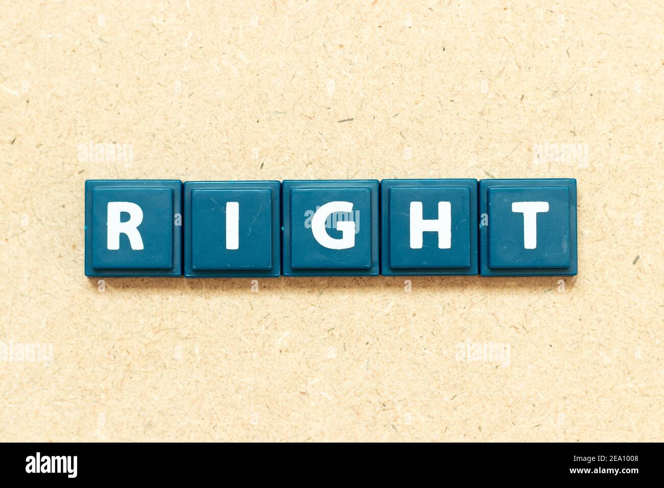 Tile alphabet letter in word right on wood background Stock Photo - Alamy