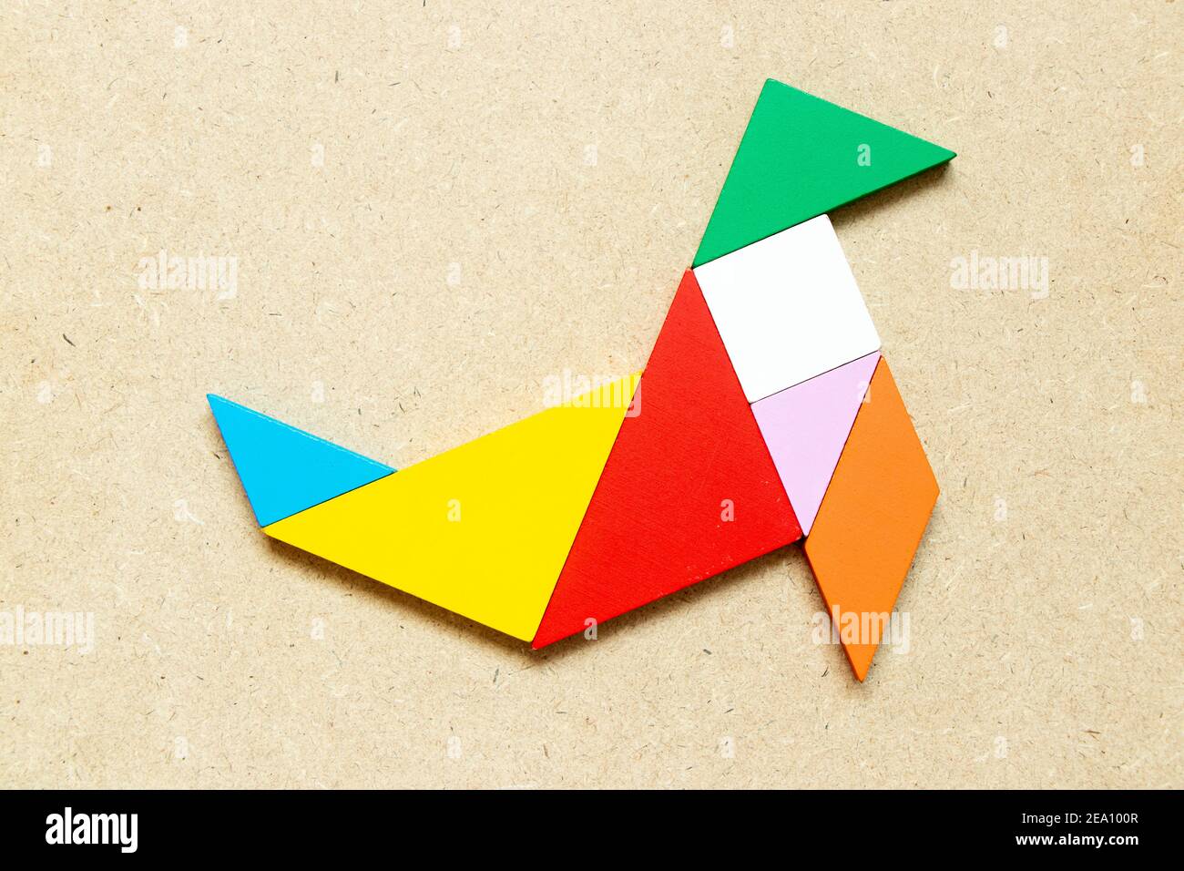 Color tangram puzzle in seal or sea lion shape on wood background Stock ...