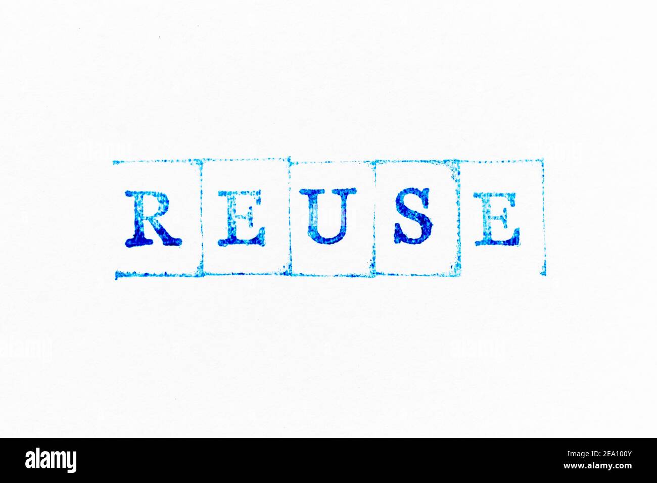 Blue color ink rubber stamp in word reuse on white paper background ...