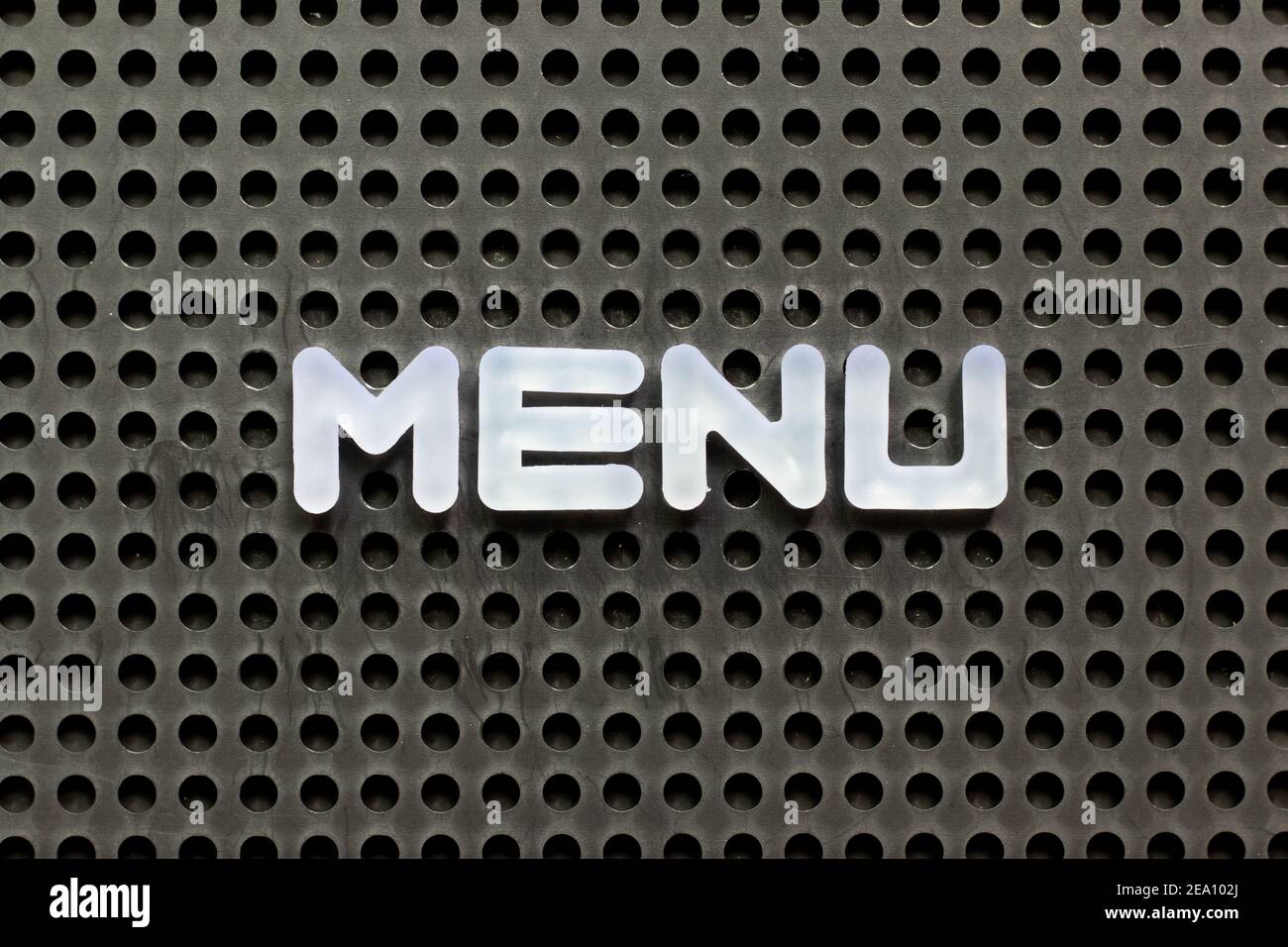 White color letter in word menu on black pegboard background Stock ...