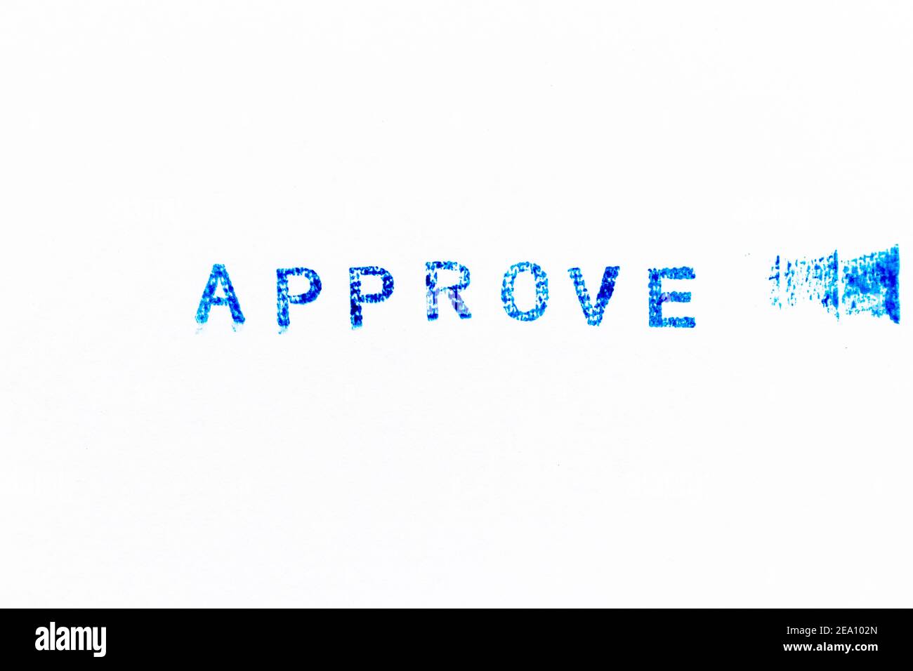 Blue color ink of rubber stamp in word approve on white paper ...