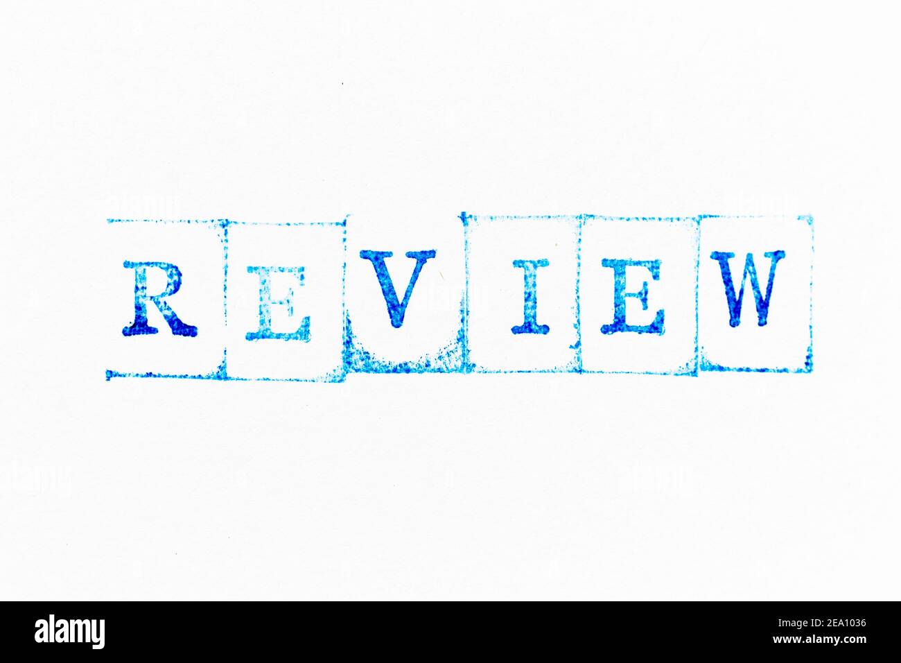 Blue color review word ink rubber stamp on white paper background Stock ...