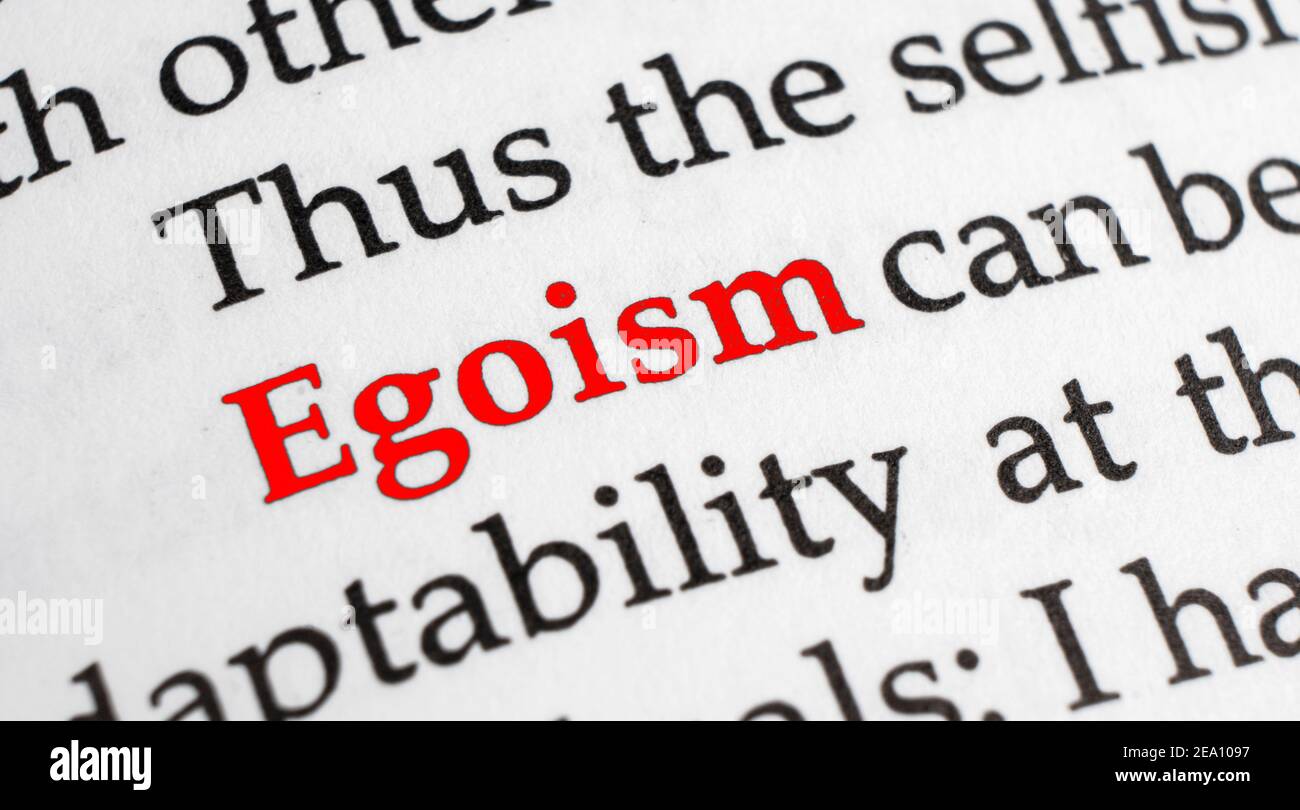 Selective focus on the red word egoism. Macro shot printed red colour ...
