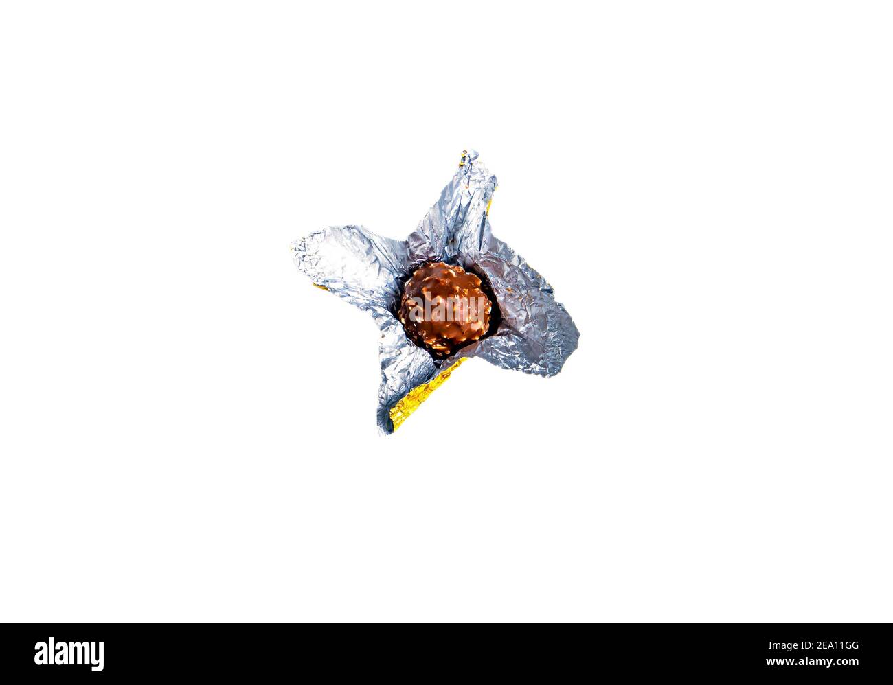 Round chocolate candies in a foil wrapper on a white background. Sweet ...