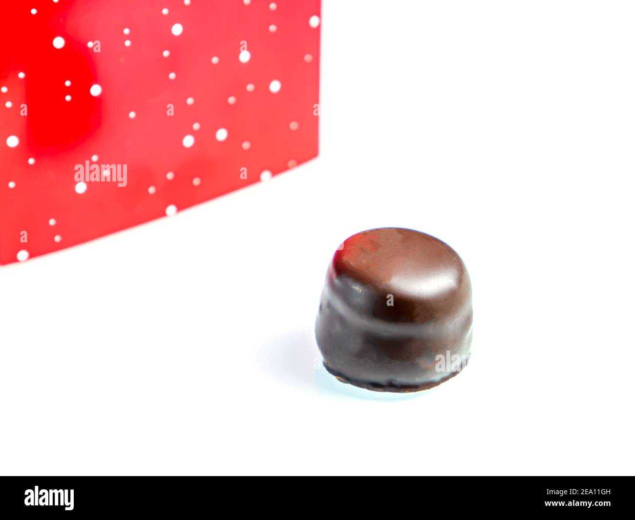 Round chocolate candy on a white background. Black chocolate. Candy ...