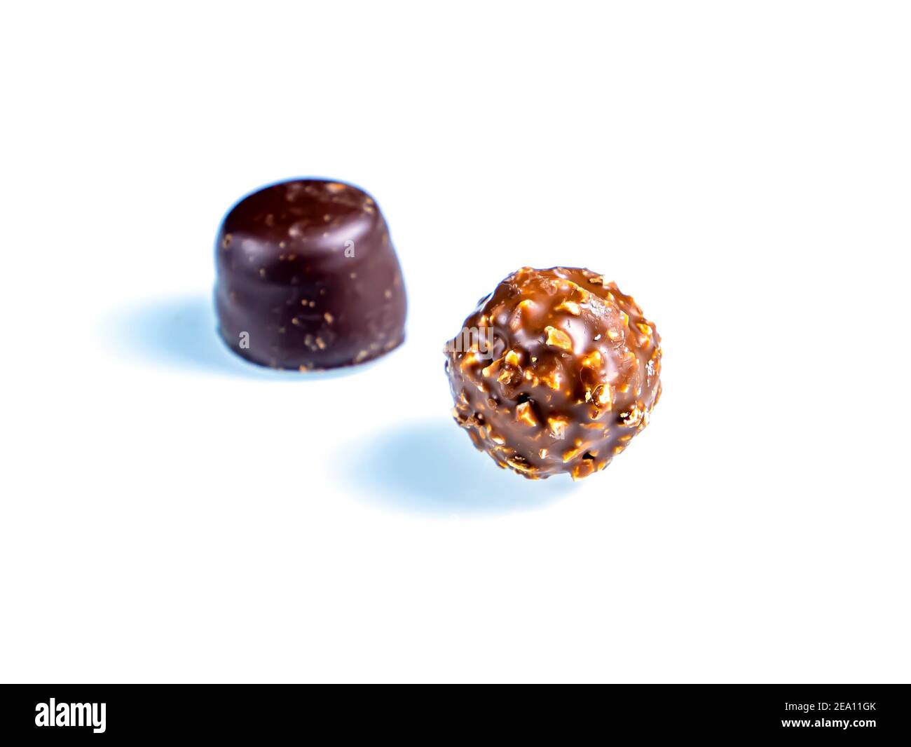 Round chocolate candy on a white background. Black chocolate. Candy ...