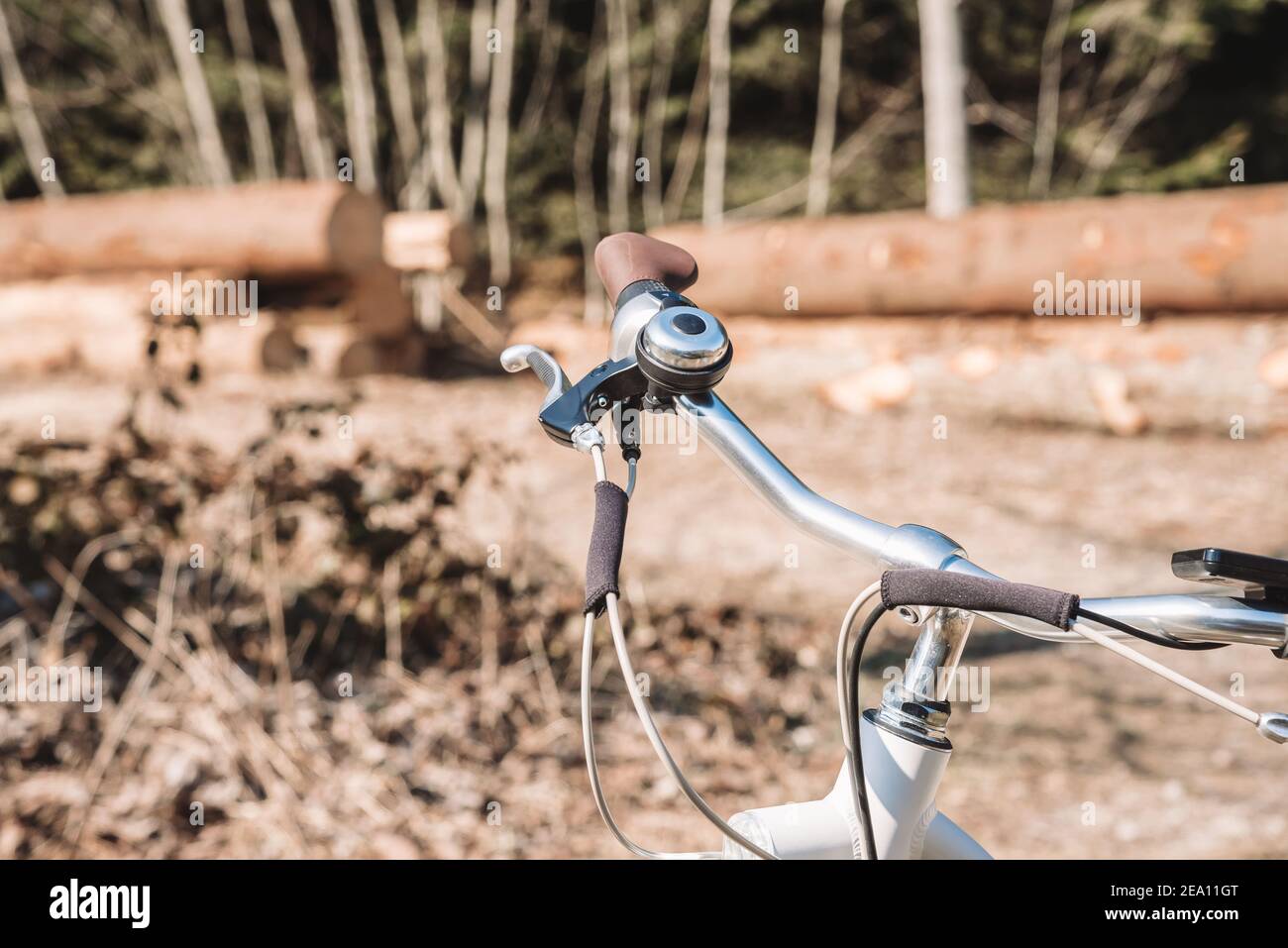 Detail view of bicycle on road with background Stock Photo - Alamy