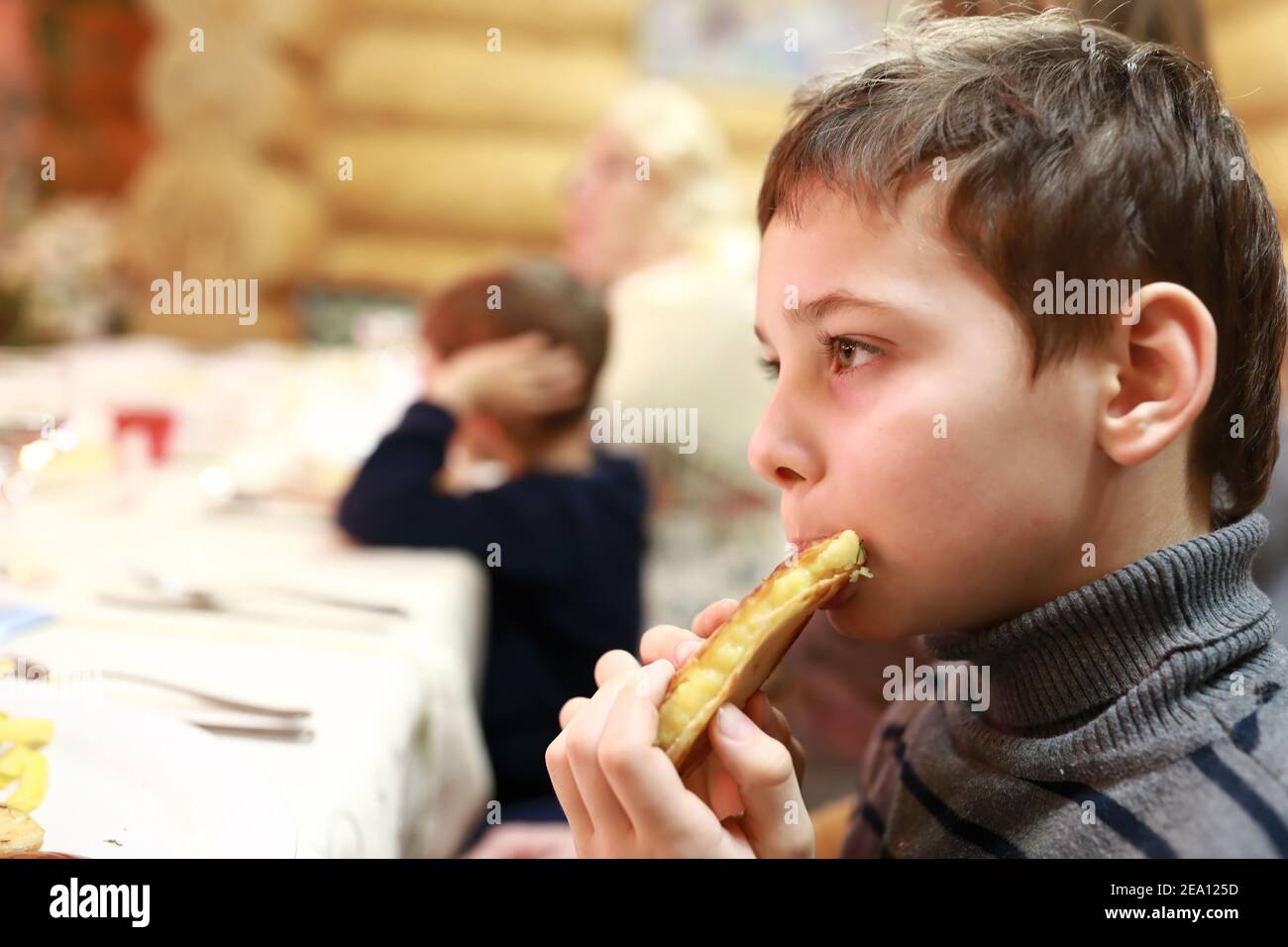 Child eating Qistibi with potato in tatar restaurant Stock Photo - Alamy