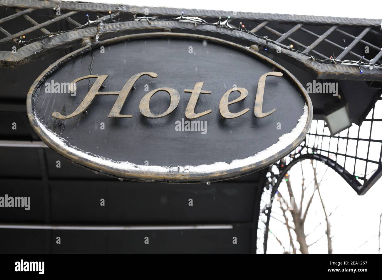 View of metal signboard hotel in winter Stock Photo - Alamy