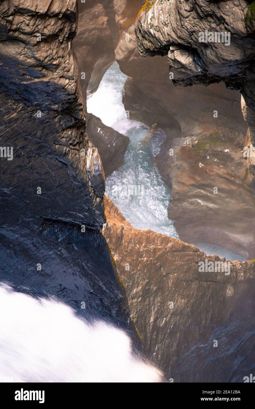 Flowing water of a waterfall inside a mountain Stock Photo - Alamy