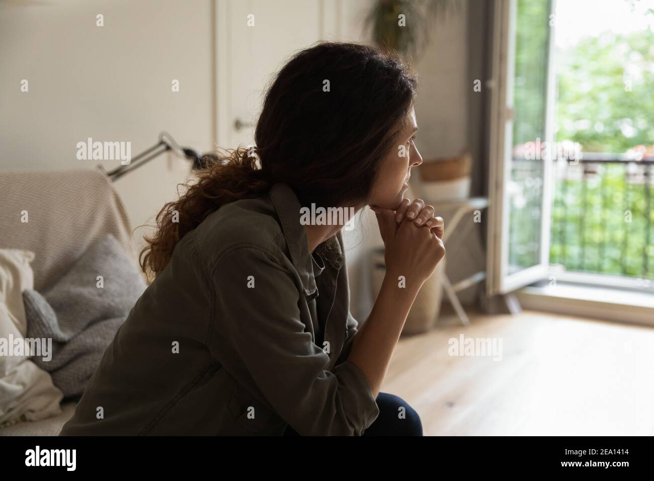 Pensive young woman look in distance consider problem solution Stock ...