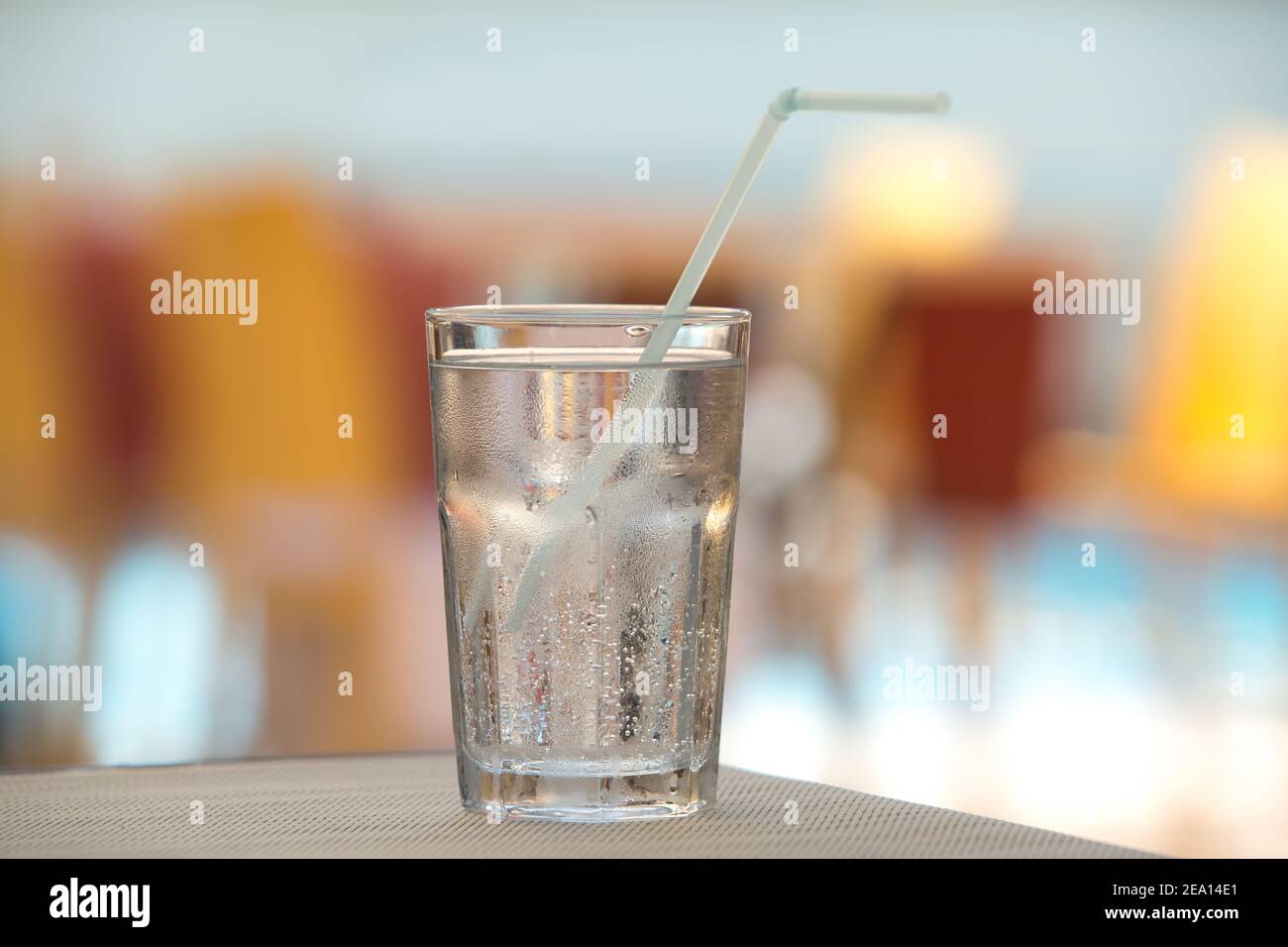 A glass of cool mineral sparkling water is on the table in the summer cafe Stock Photo - Alamy