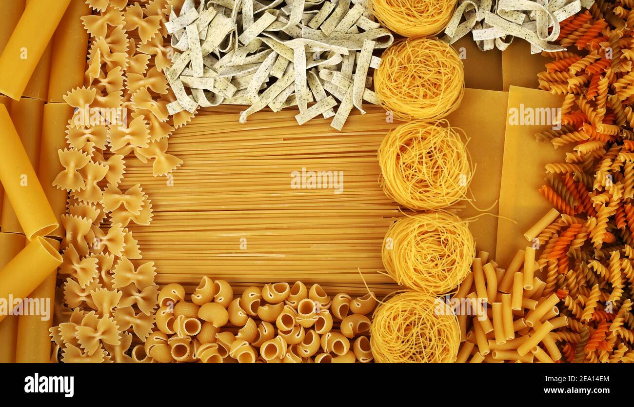 Raw italian pasta mix background Stock Photo - Alamy