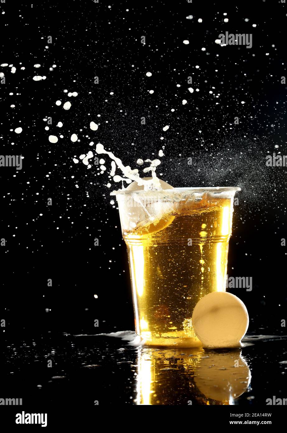 beer and ping pong balls over black Stock Photo - Alamy