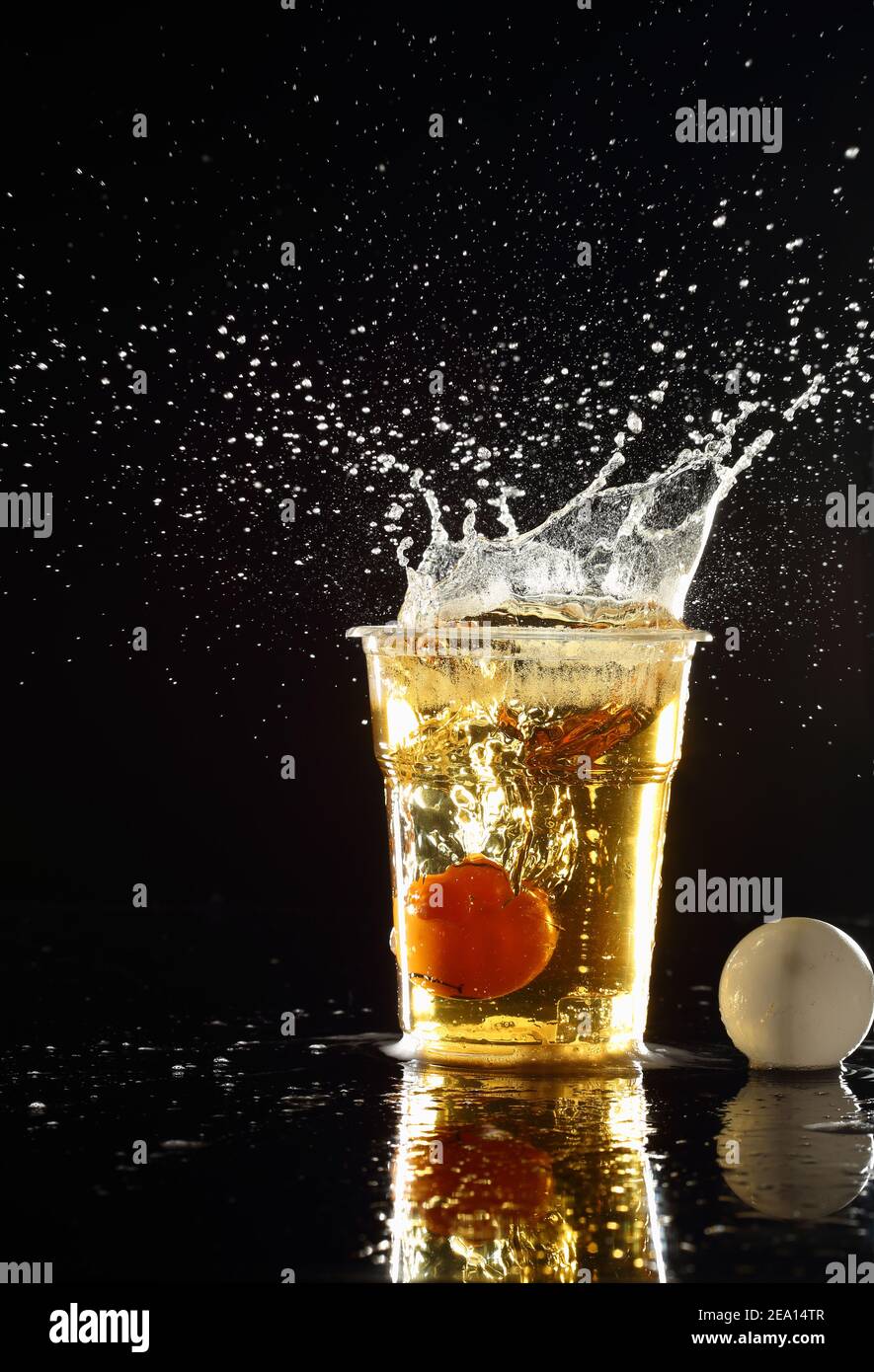 beer and ping pong balls over black Stock Photo - Alamy