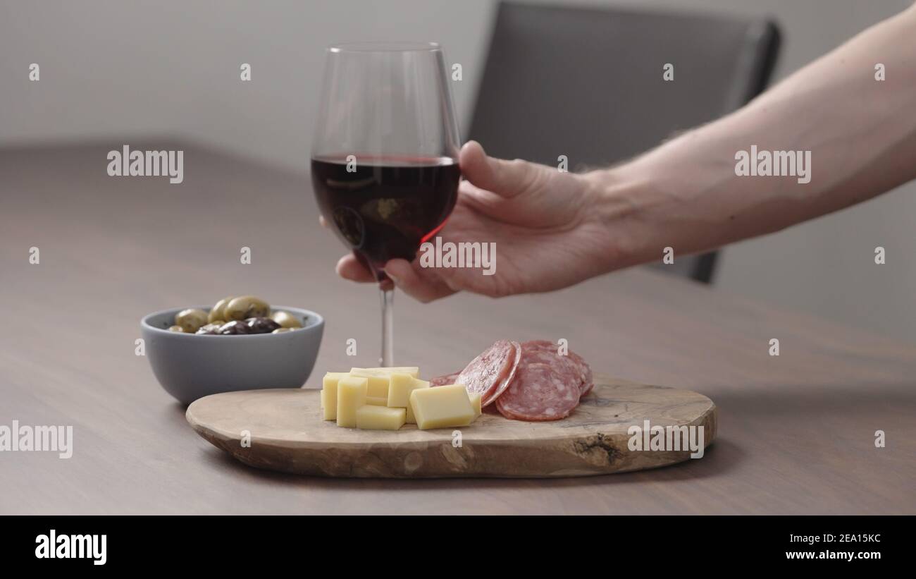 Hand take red wine hi-res stock photography and images - Alamy