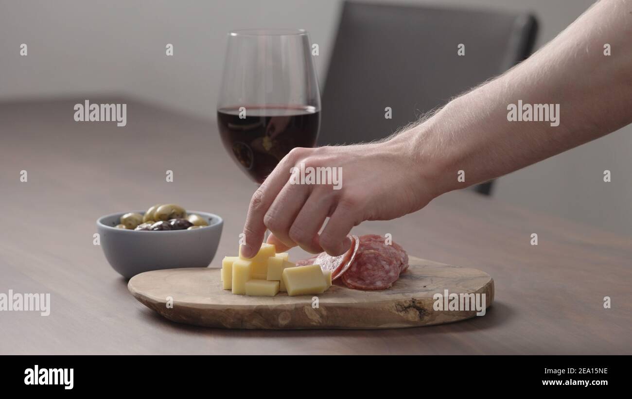 man hand take appetizers from a table, wide photo Stock Photo - Alamy
