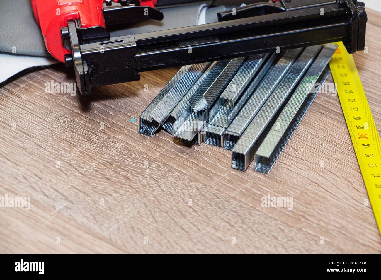 concept of furniture production and repair. Stapler and staples ...
