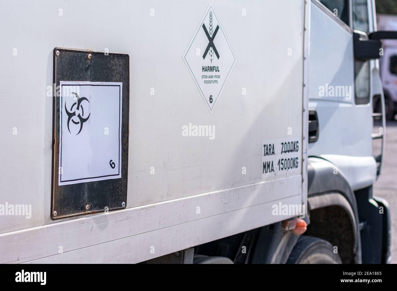 Truck transporting infectious goods with their respective danger labels ...