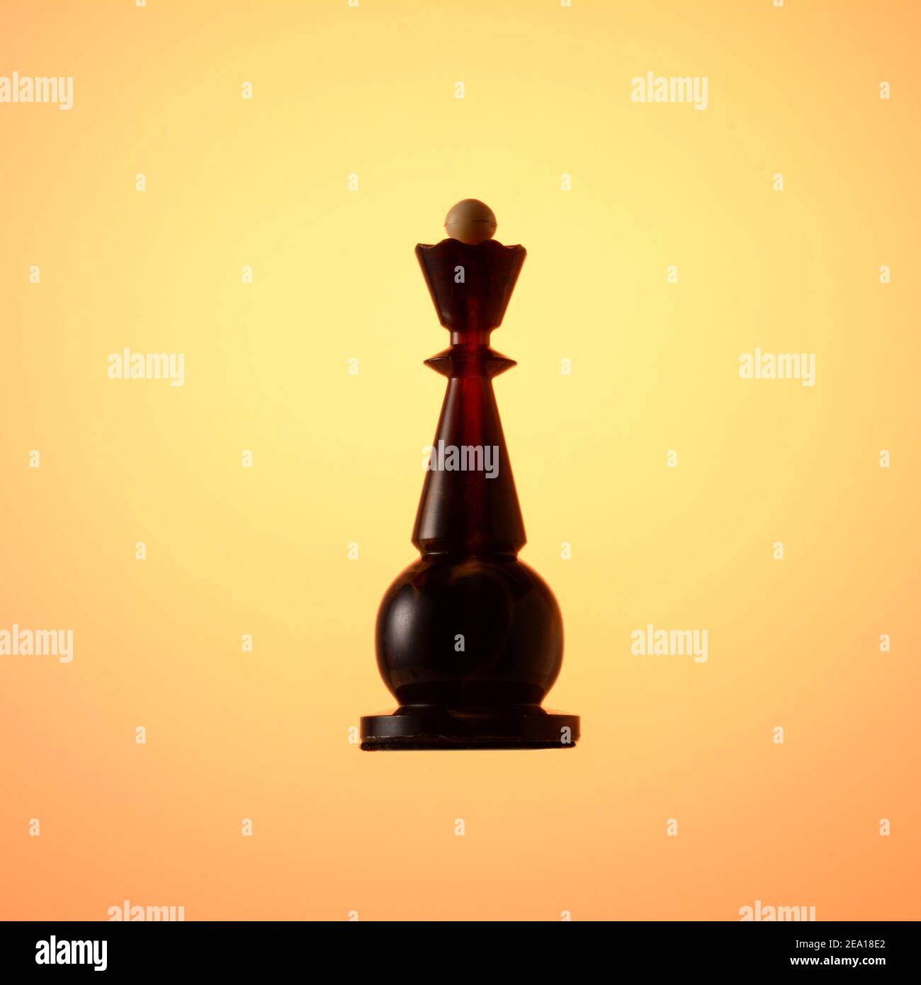 Amber chess set, chess piece Black Queen on gold gradient background ...