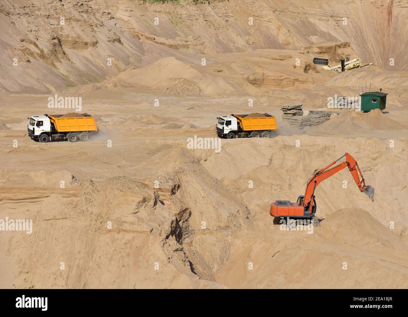 Dump truck transports sand in open pit mine. In the production of ...