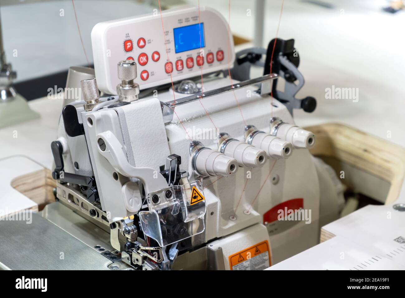 Close-up of details of modern white professional electric sewing ...