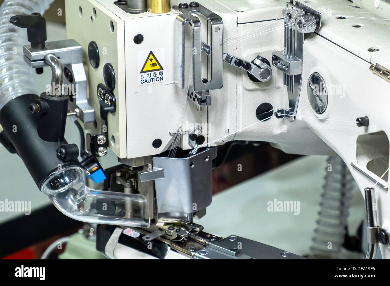 Close-up of details of modern white professional electric sewing ...