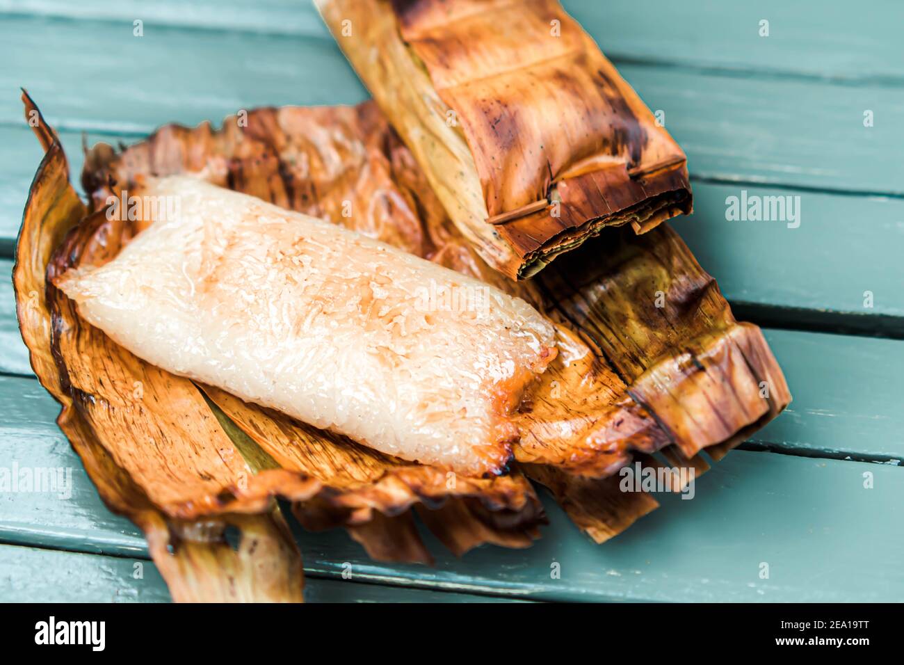 Thai traditional dessert. Grilled Taro Stuffed Coconut Sticky Rice ...