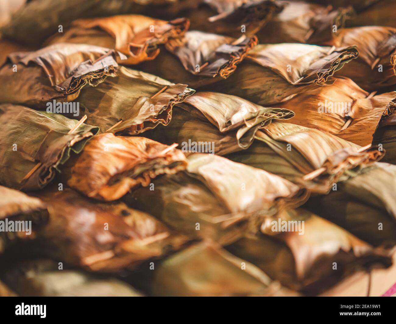 Thai traditional dessert. Grilled Taro Stuffed Coconut Sticky Rice ...