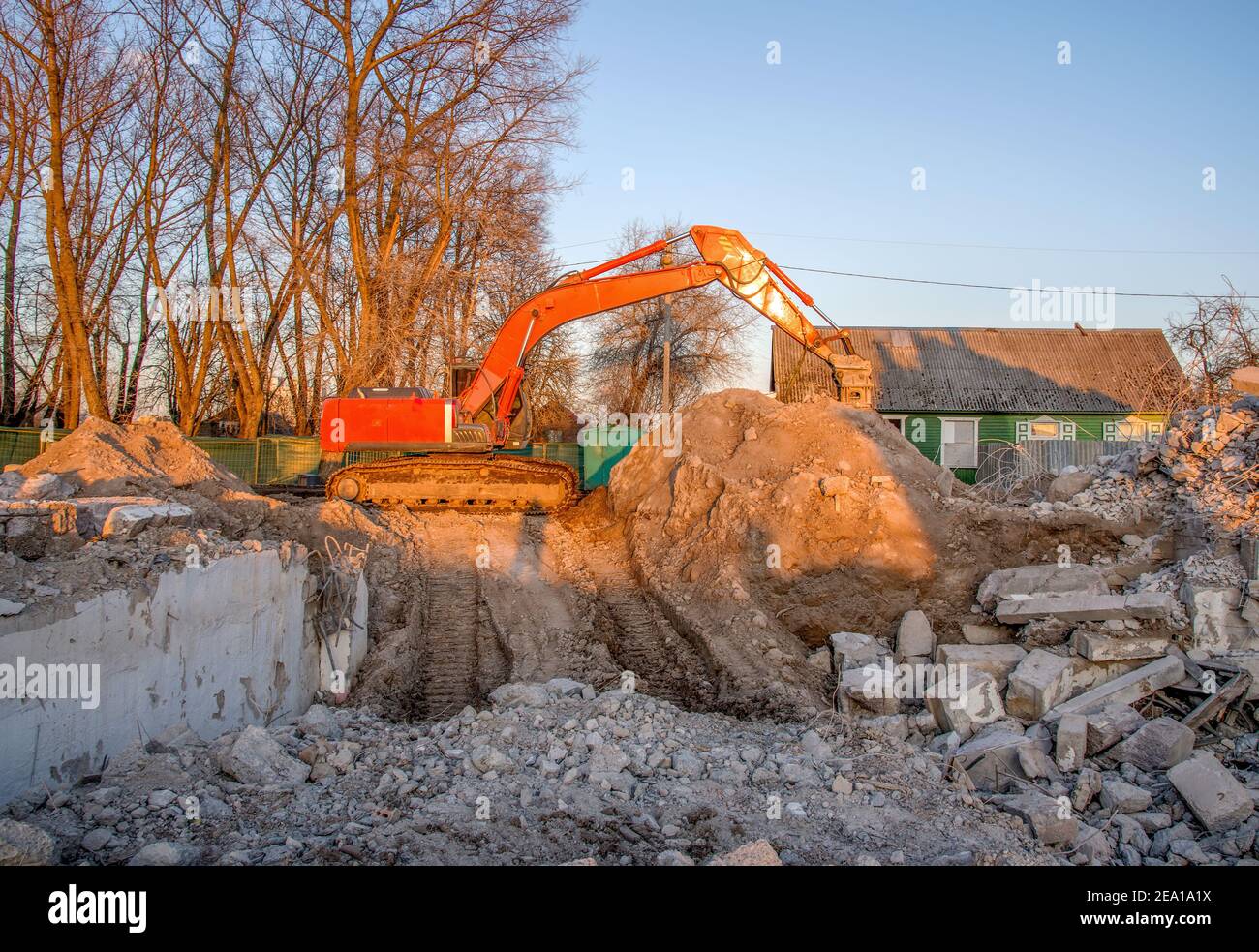 Excavator with hydraulic breaker hammer for the destruction of concrete ...